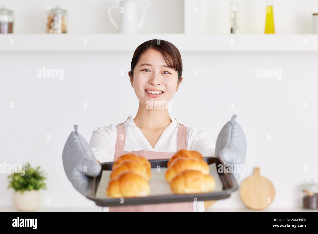 Japanese woman cooking in the kitchen Stock Photo - Alamy