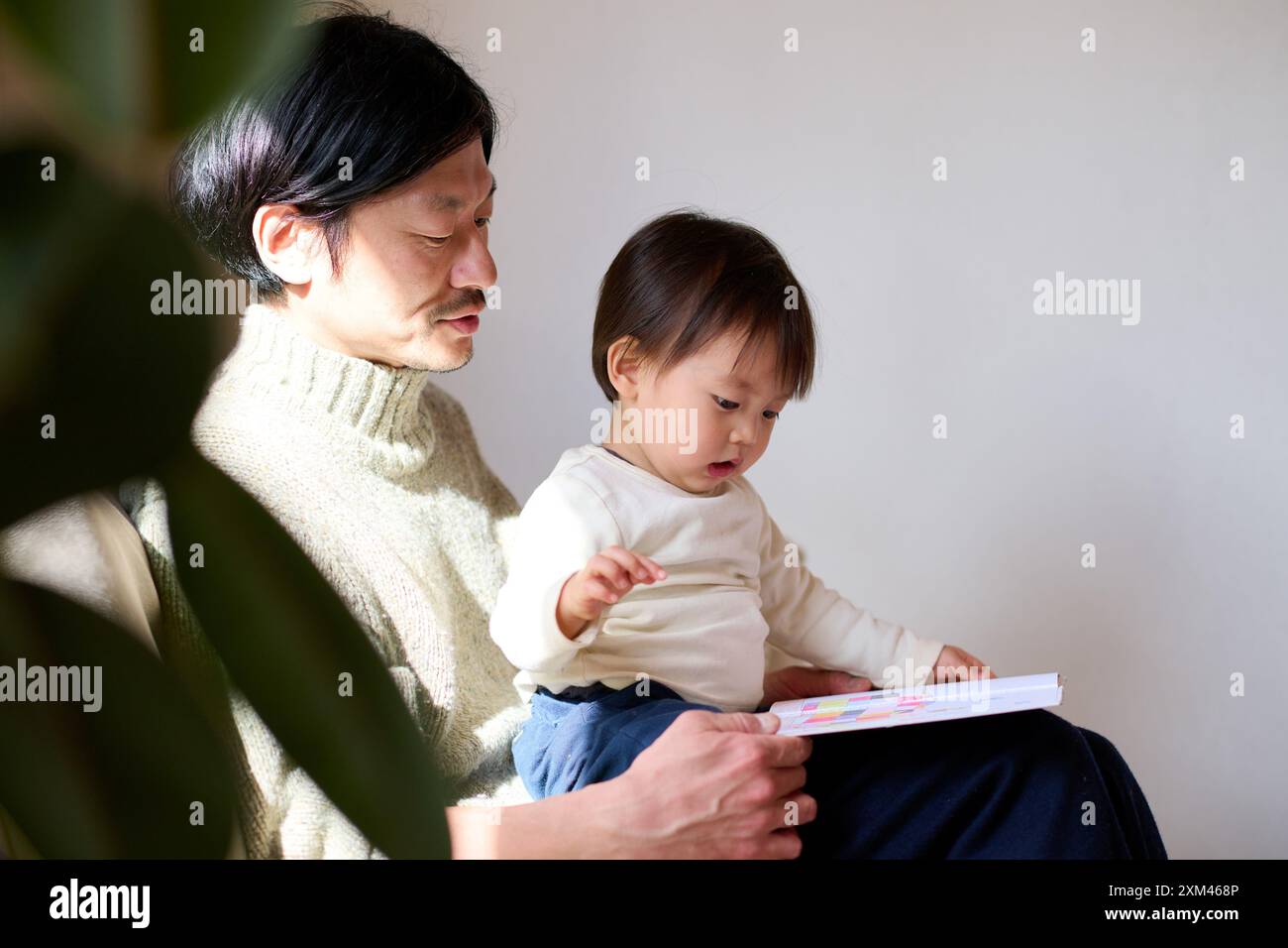 Aged father adult son reading hi-res stock photography and images - Alamy