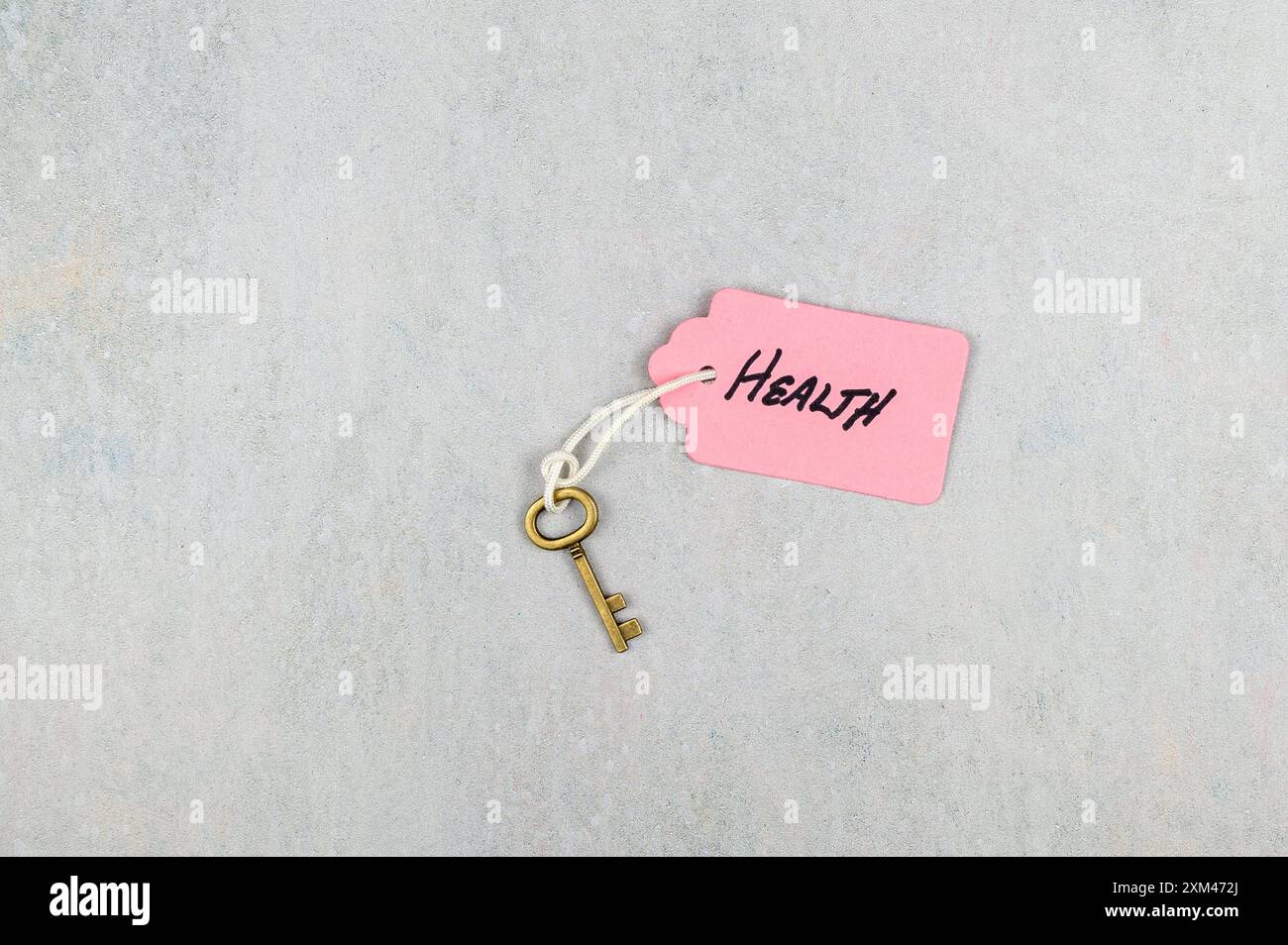 Concept photo depicting key to health on gray background Stock Photo ...