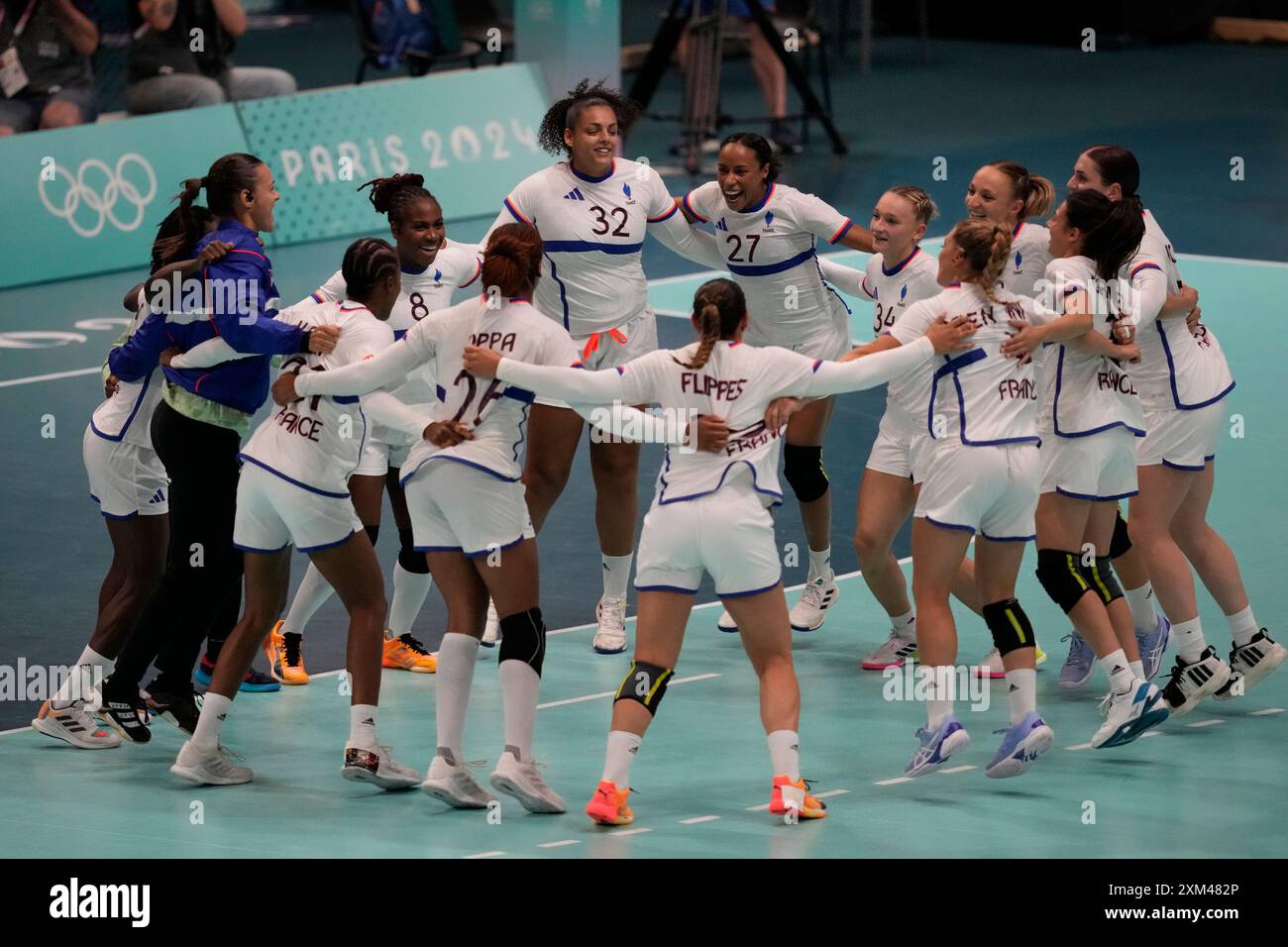 French players celebrate after winning against Hungary during the women ...