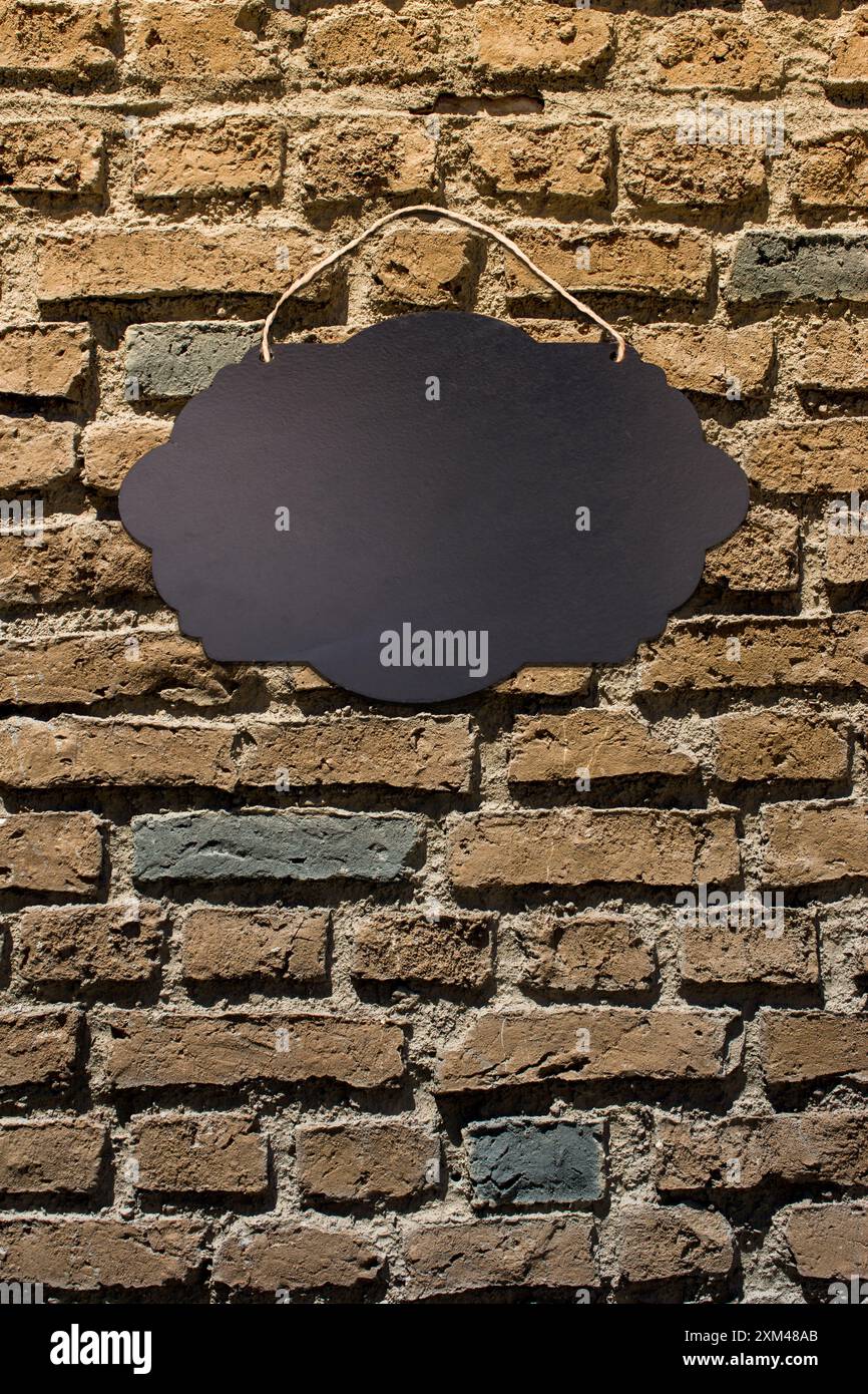 Black Empty Sign Board with string for hanging on wall Stock Photo - Alamy