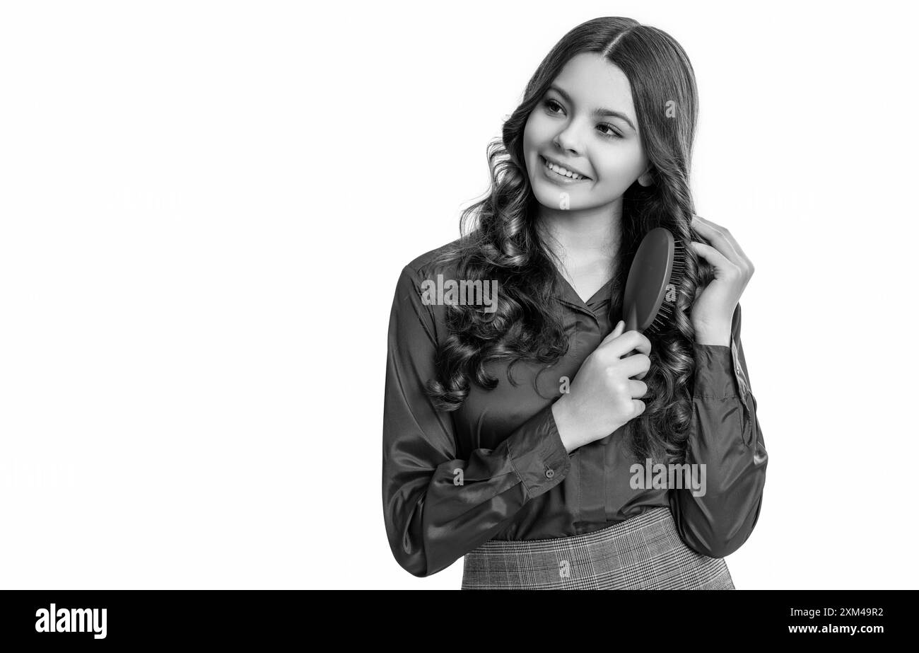 teen girl combing hair isolated on white. teen girl combing hair in ...