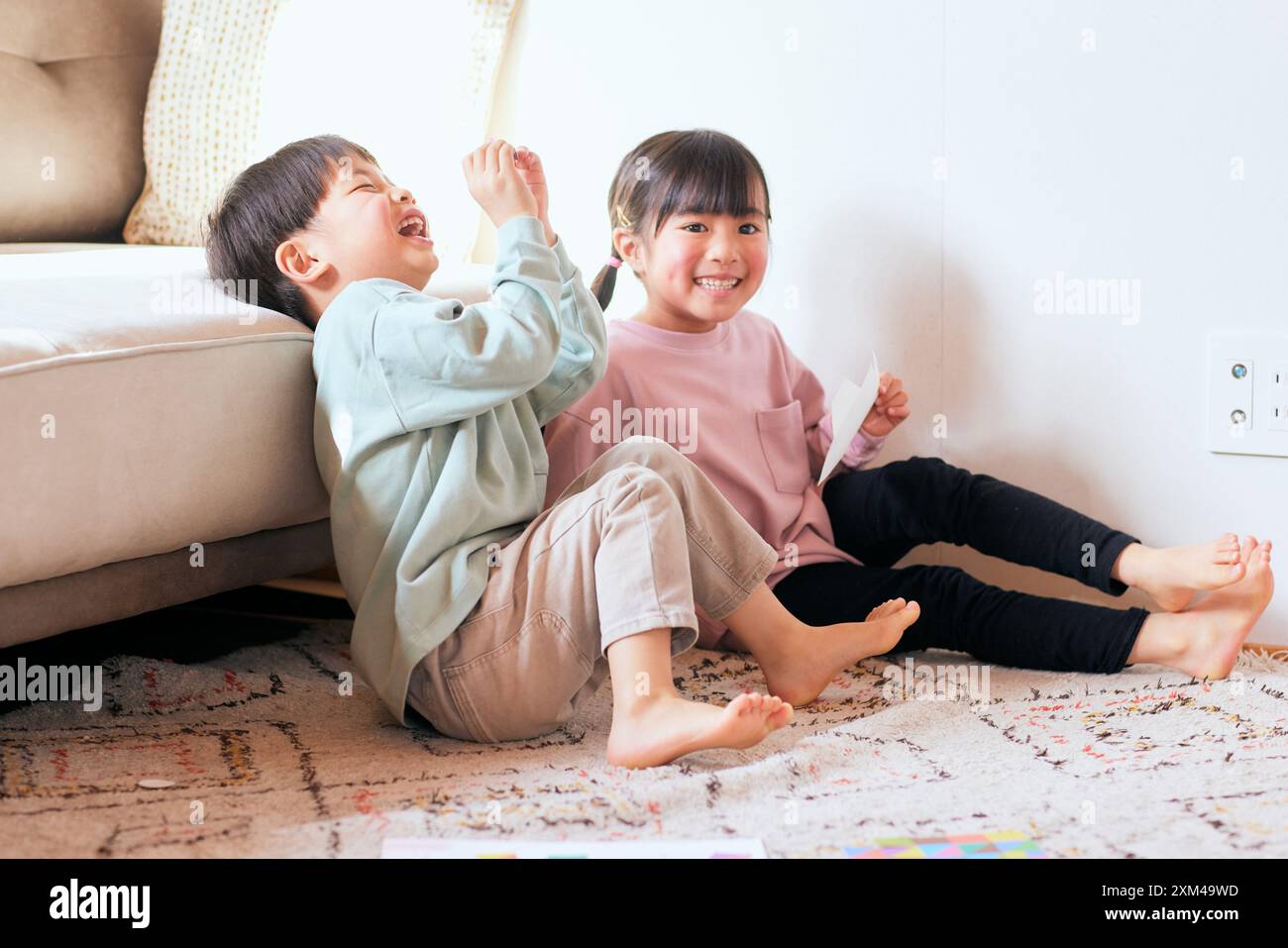 Happy Japanese kids playing on the floor Stock Photo - Alamy