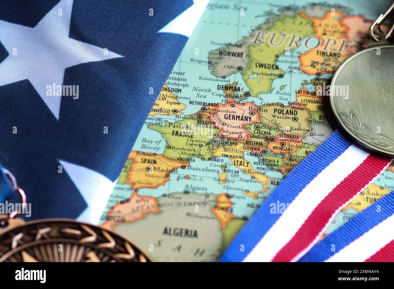 Macro image of Europe map with medals and US flag Stock Photo - Alamy