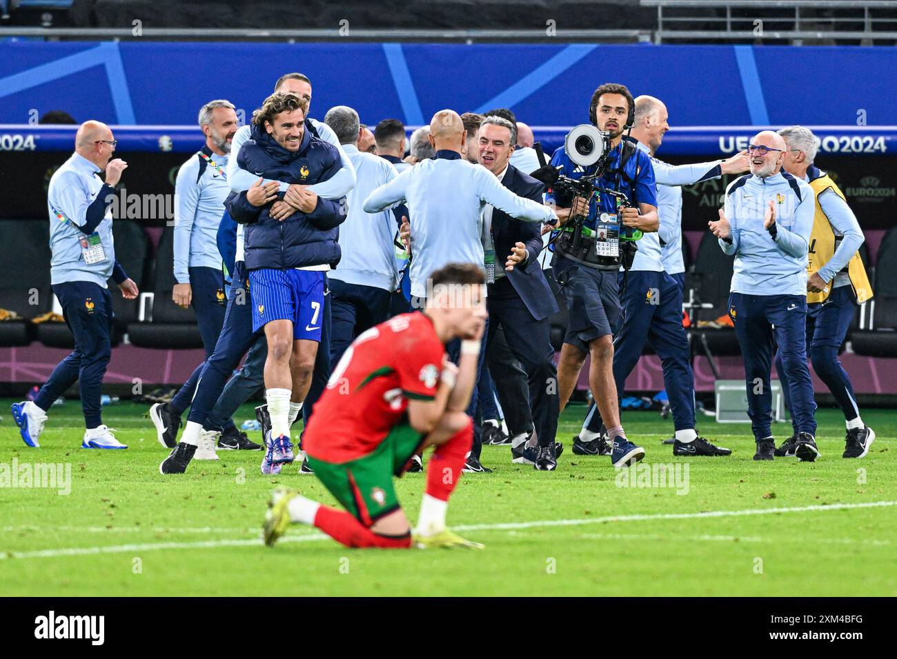 The players and staff of France celebrate because they can go to the ...