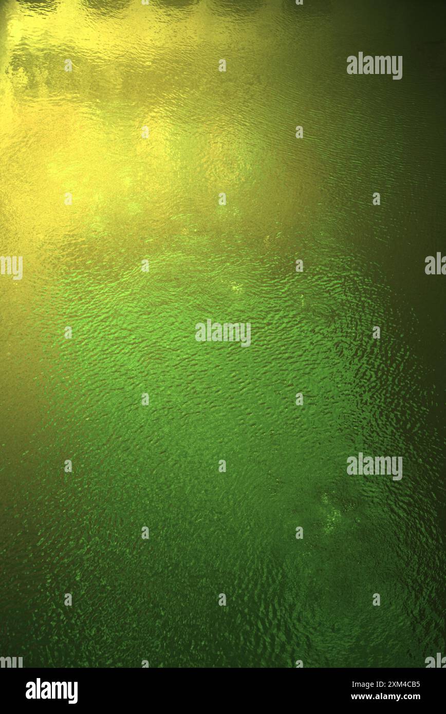 Bubbling natural spa water in green and yellow hues in England, UK ...