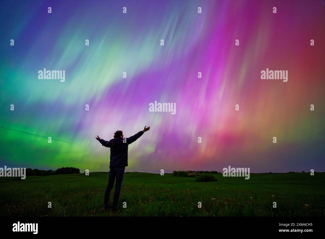 A person is observing a magnificent Aurora Borealis light display in an ...