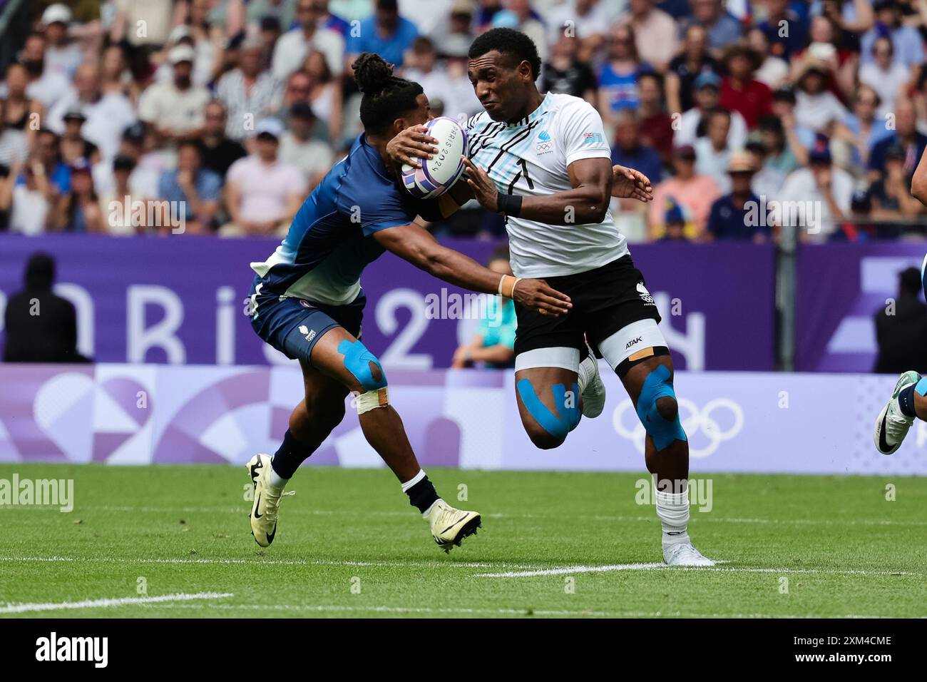 Paris, France, 25 July, 2024. Joji Nasova (1) of Team Fiji runs the ...