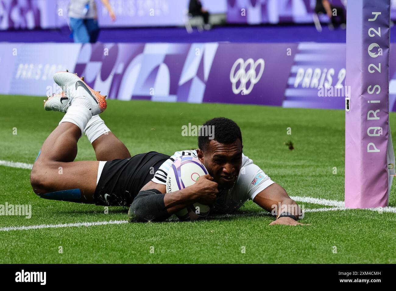 Paris, France, 25 July, 2024. Joji Nasova (1) of Team Fiji scores a try ...