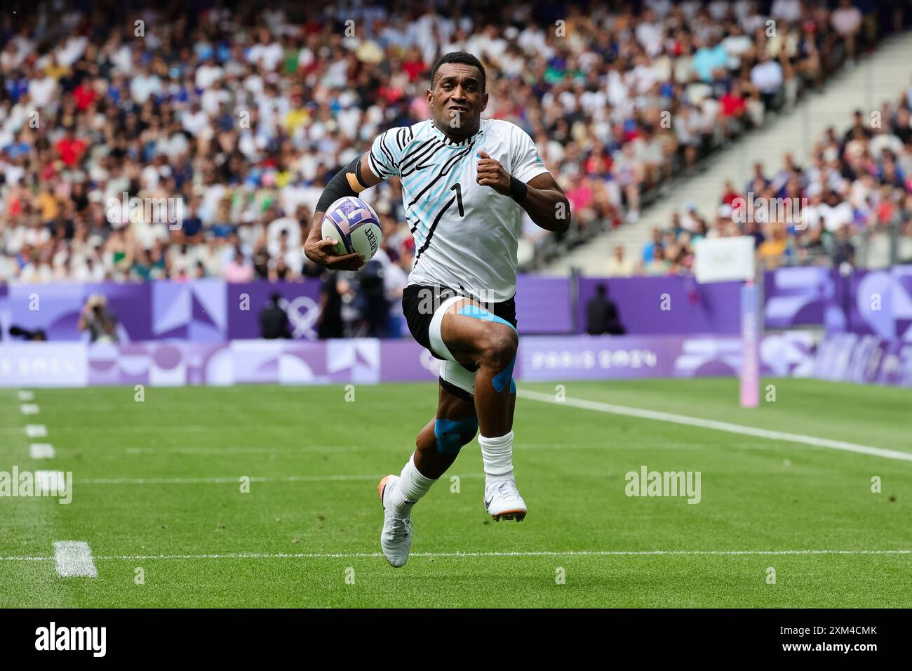 Paris, France, 25 July, 2024. Joji Nasova (1) of Team Fiji scores a try ...
