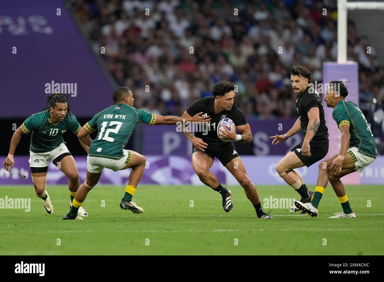 New Zealand's Moses Leo, (11), attempts to break through the South ...
