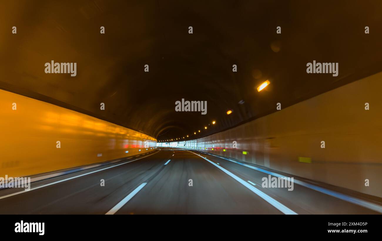 Dynamic view of a vehicle speeding through a tunnel illuminated with ...