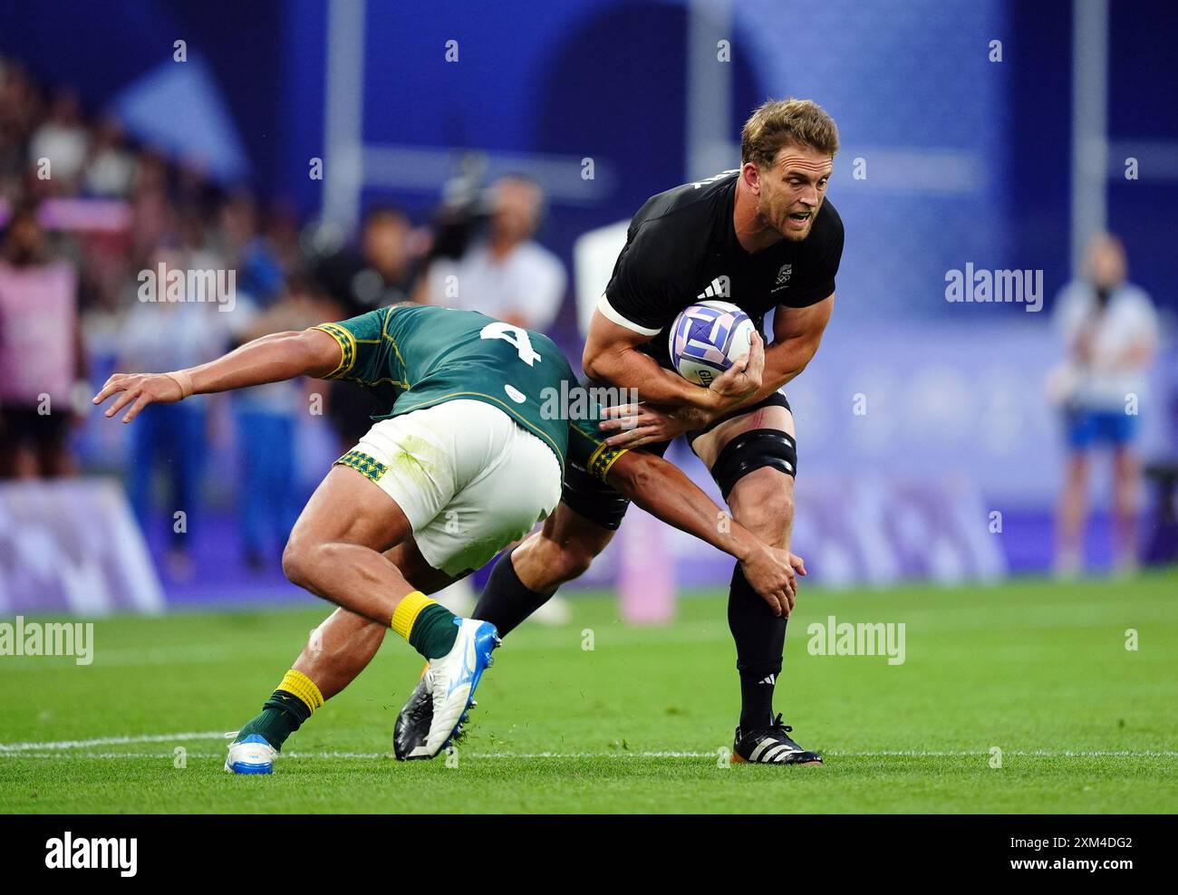 New Zealand's Scott Curry is tackled by South Africa's Zain Davids ...