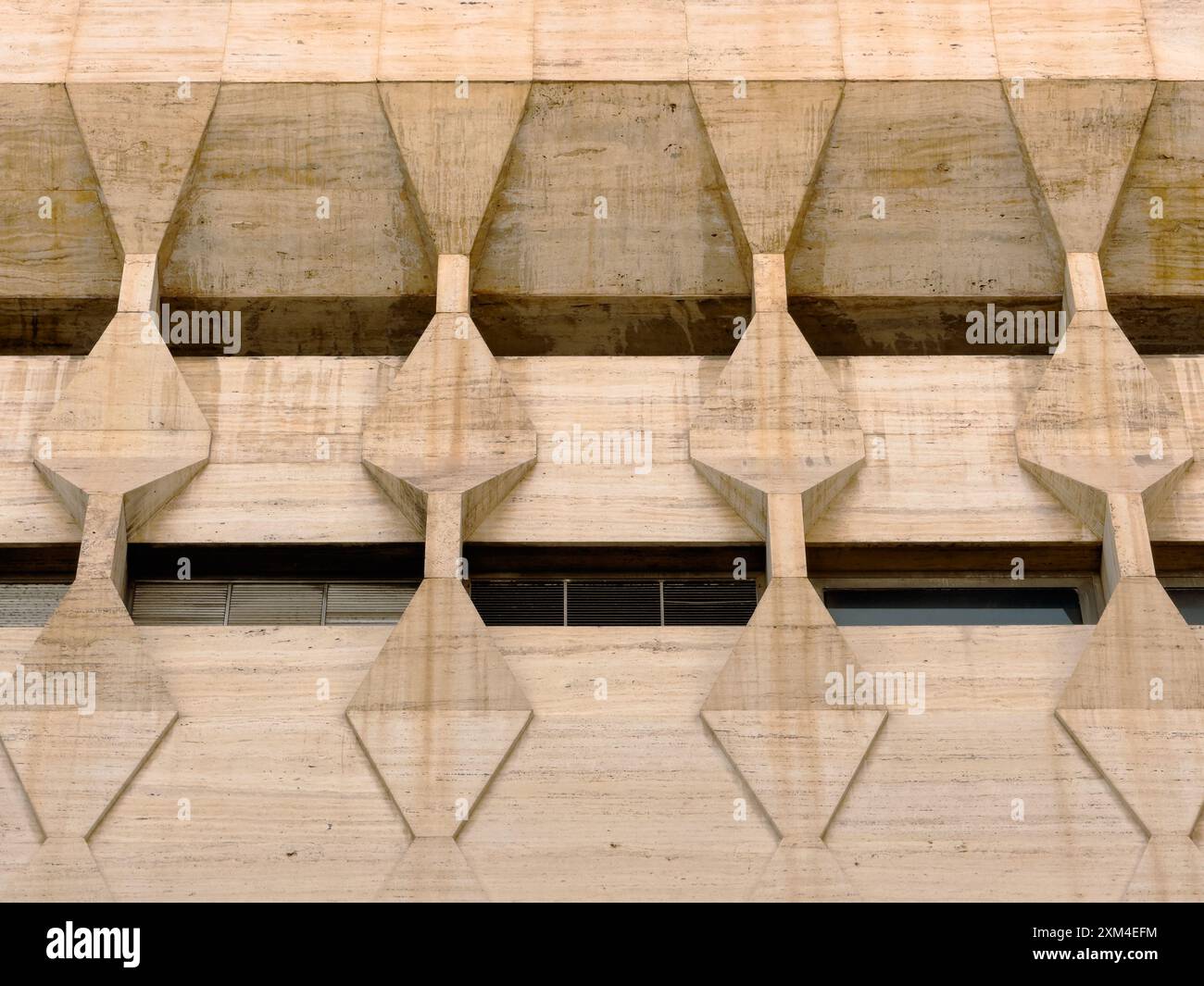 Close Up Of A Concrete Building Facade Featuring Distinctive Geometric