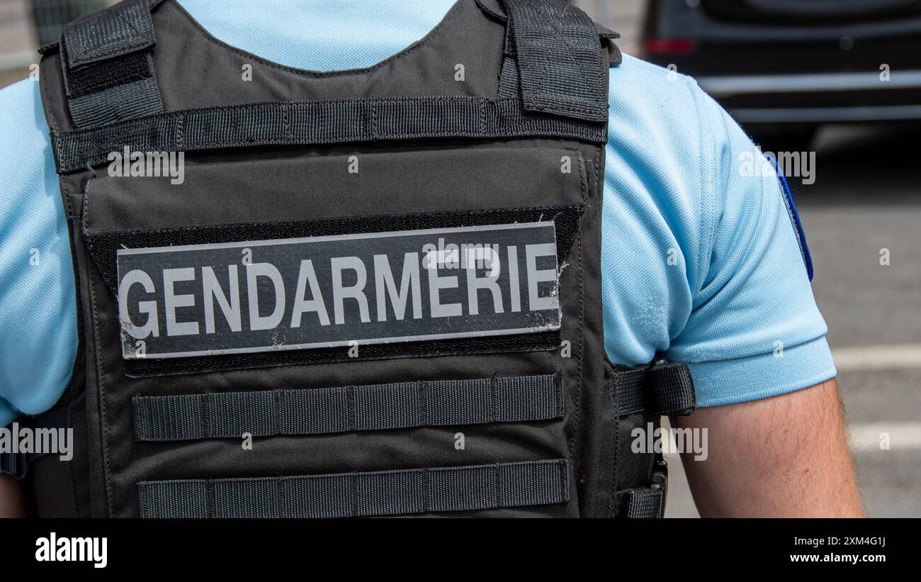 Close-up "GENDARMERIE" marking written on the back of a bulletproof ...