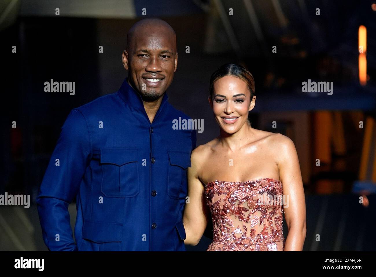 Didier Drogba, left, and Gabrielle Lemaire upon arrival at the Louis ...
