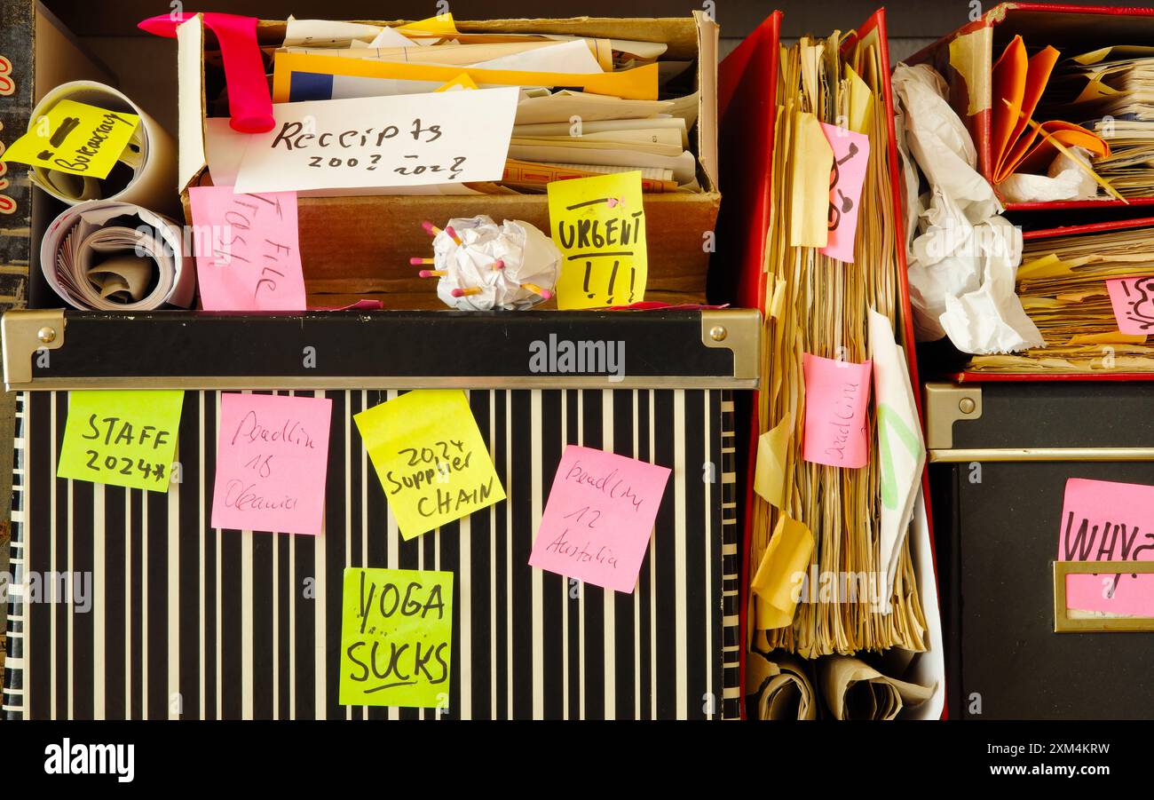 Messy file folder,sticky notes and old papers.Red tape, bureaucracy ...