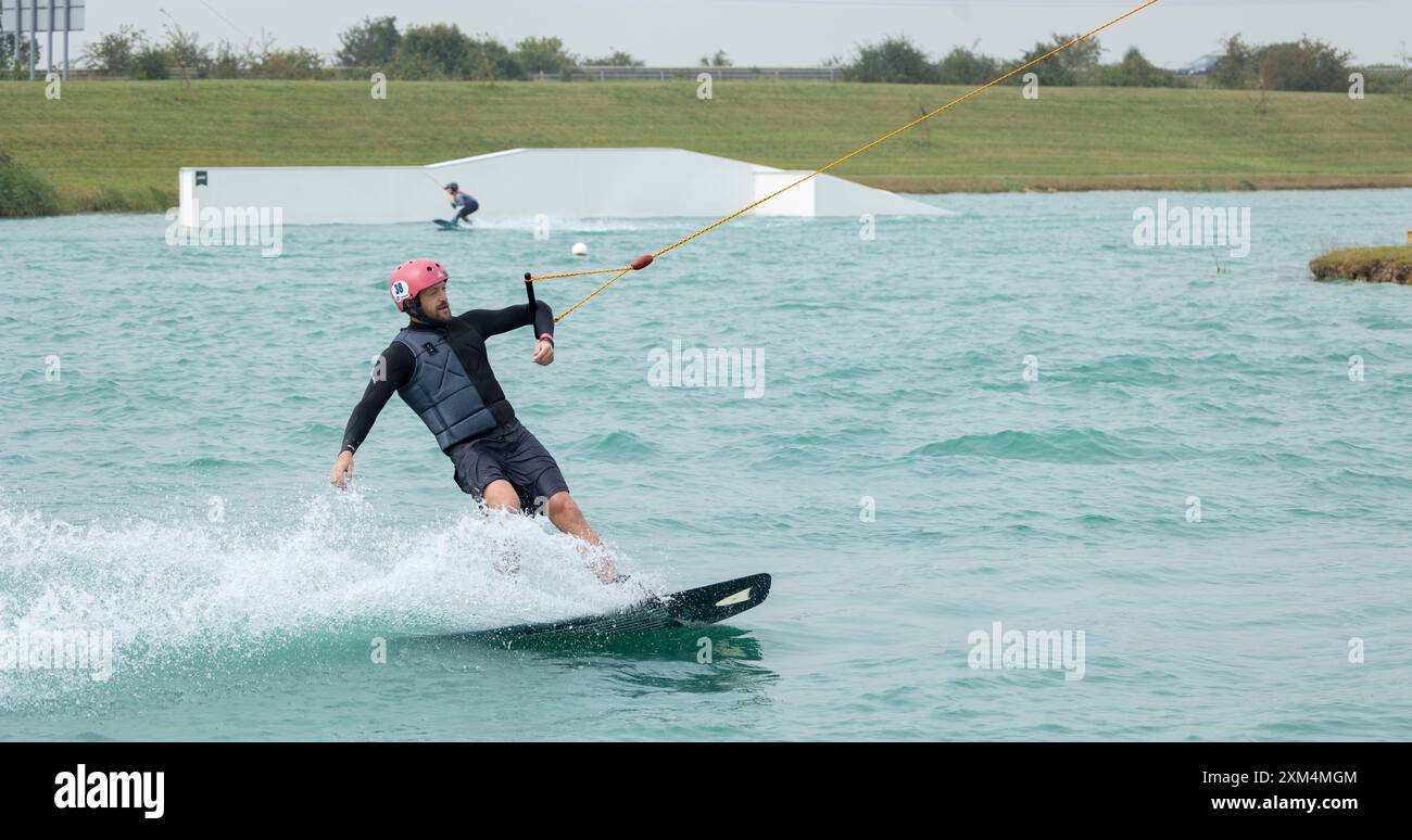 Kent, united kingdom, 22, August 2023 A male wakeboarder athlete in a ...