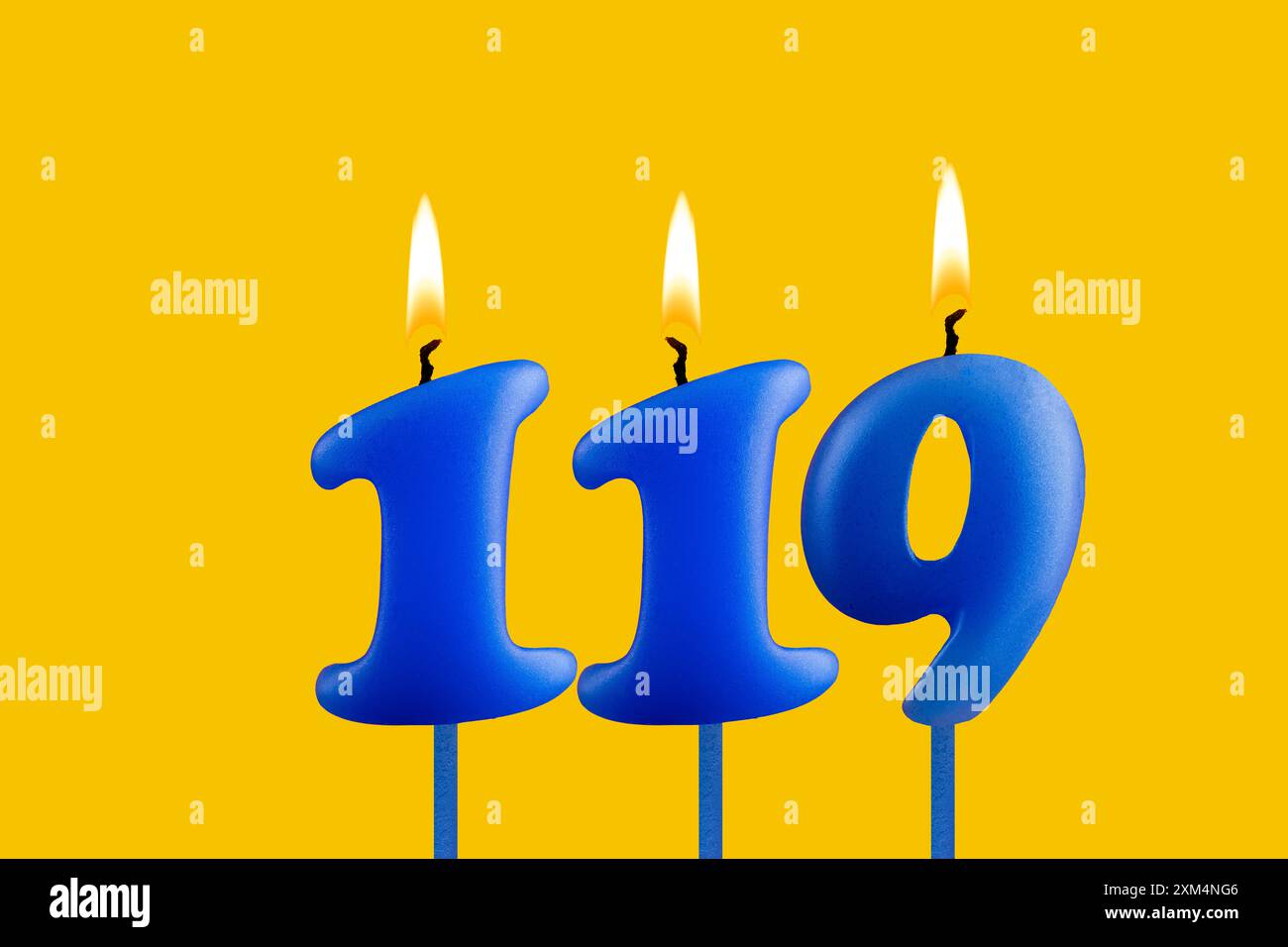 Blue birthday candle on yellow background - Number 119 Stock Photo - Alamy