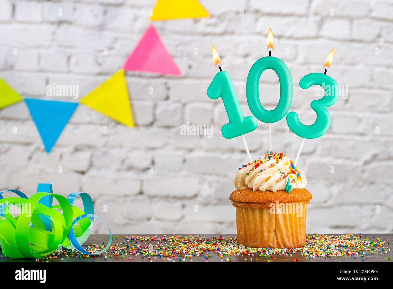 Green birthday candle - Candle number 103 Stock Photo - Alamy