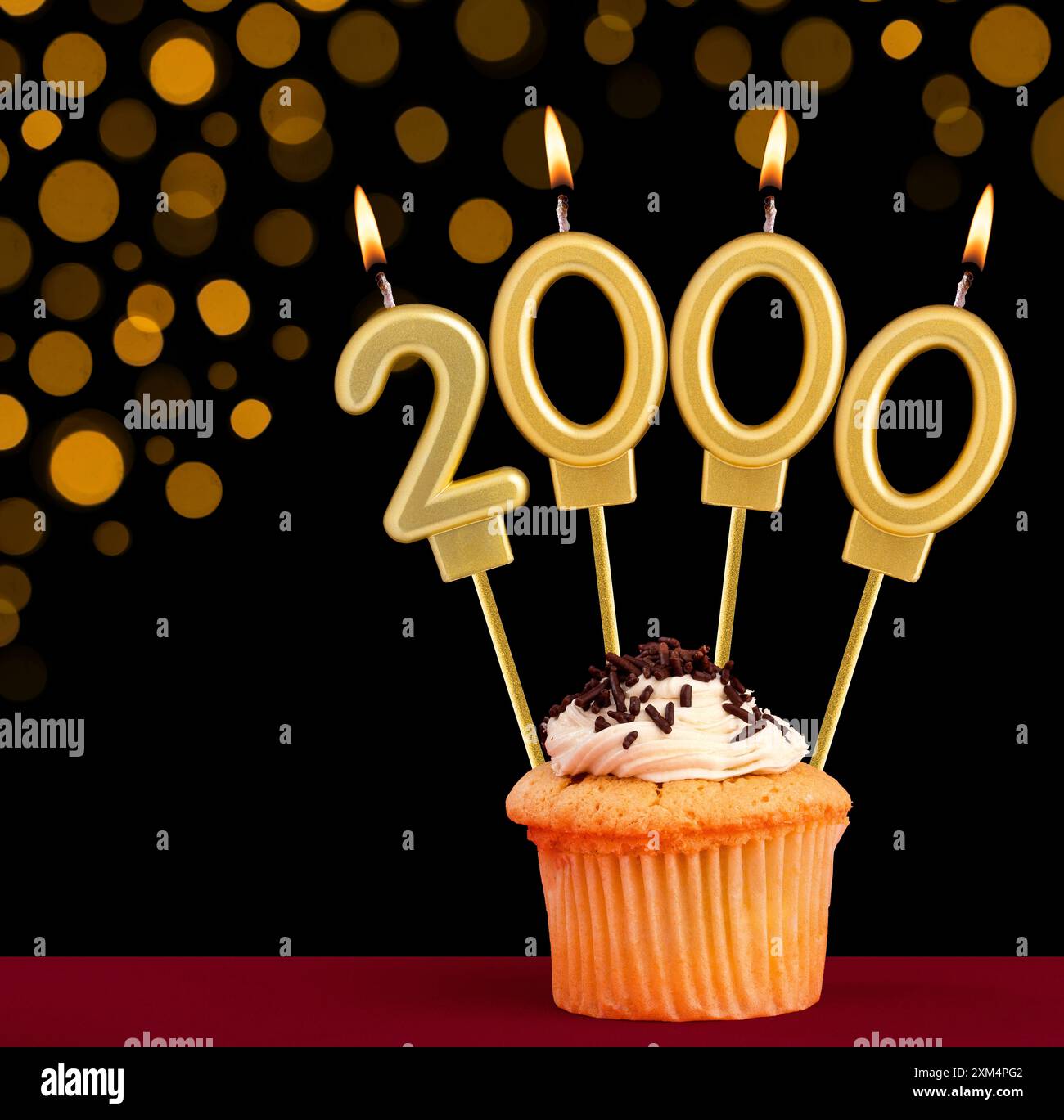 Birthday candle with cupcake - Number 2000 on black background with out of focus lights Stock ...