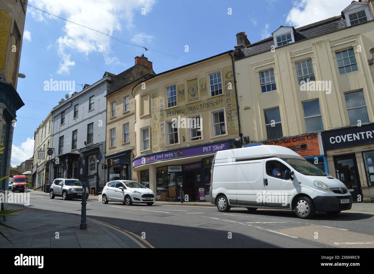Vehicles driving down Bath Road and Market Place in Frome Town Centre ...