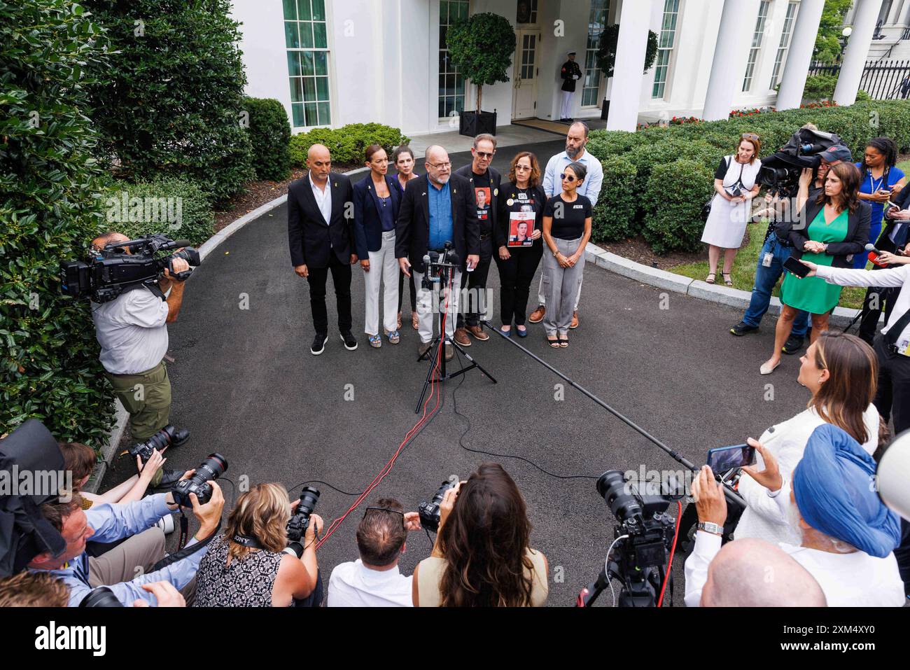 (From left to right) Adi Alexander, father of Edan Alexander, Yael ...