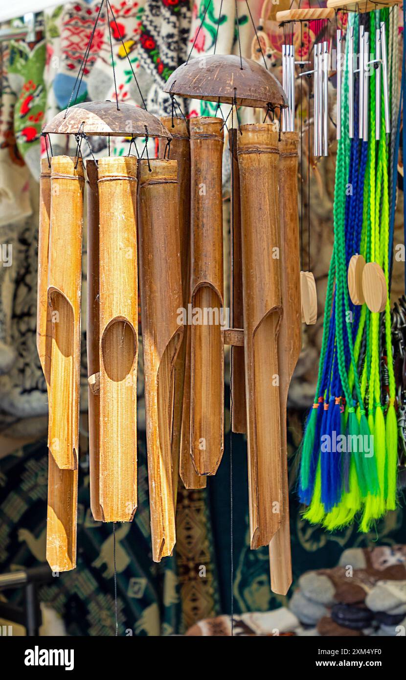 Classic wood wind chimes hanging above entrance door in rural ...
