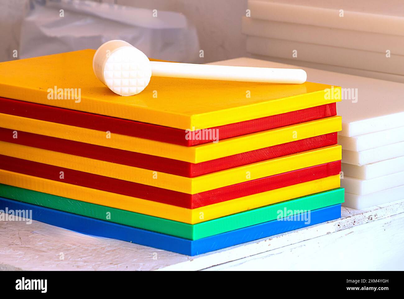 Stack of colorful plastic chopping boards sold outside on a market ...
