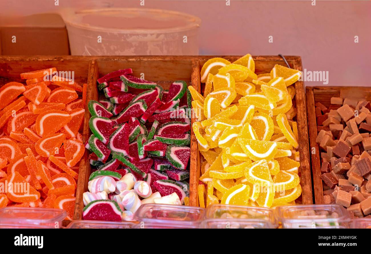 Pie of colorful dry jelly sweets sold outside on market stall Stock ...