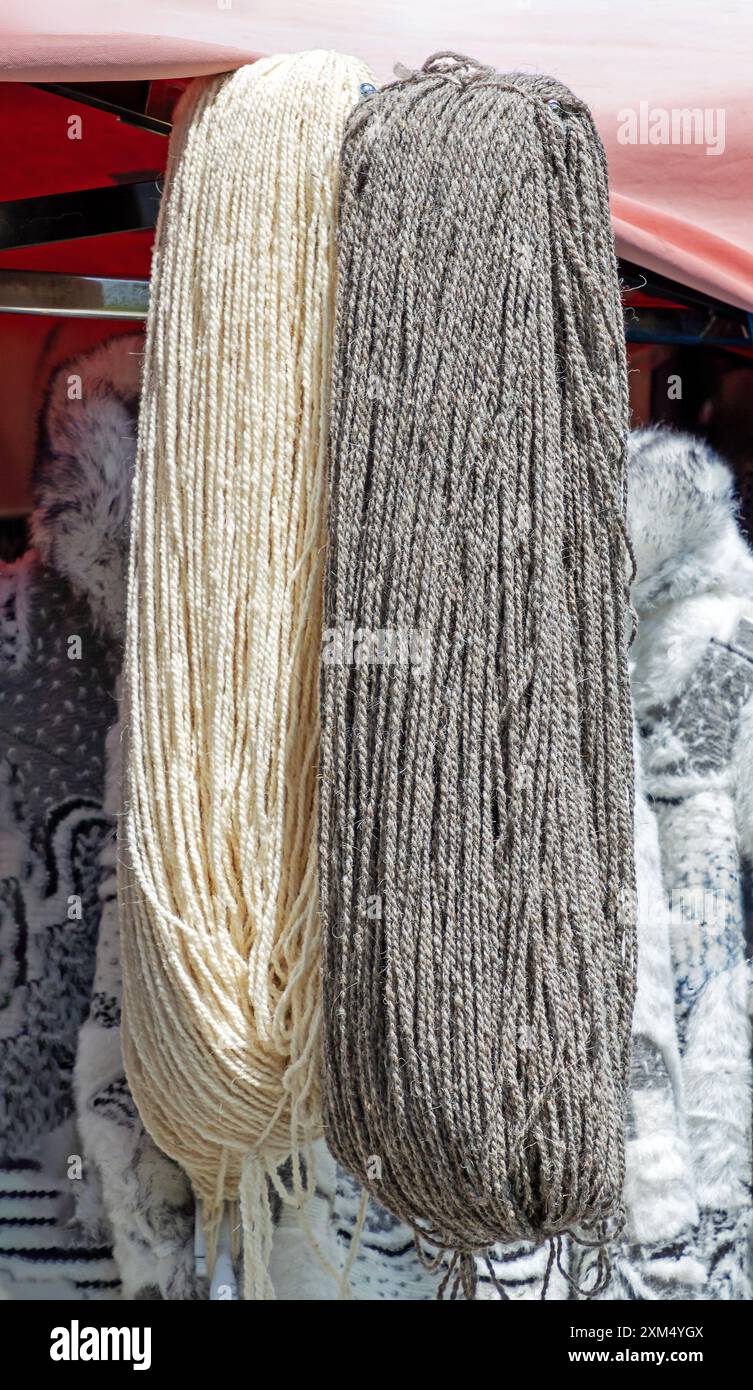 Natural wool rope material outside on market stall Stock Photo - Alamy