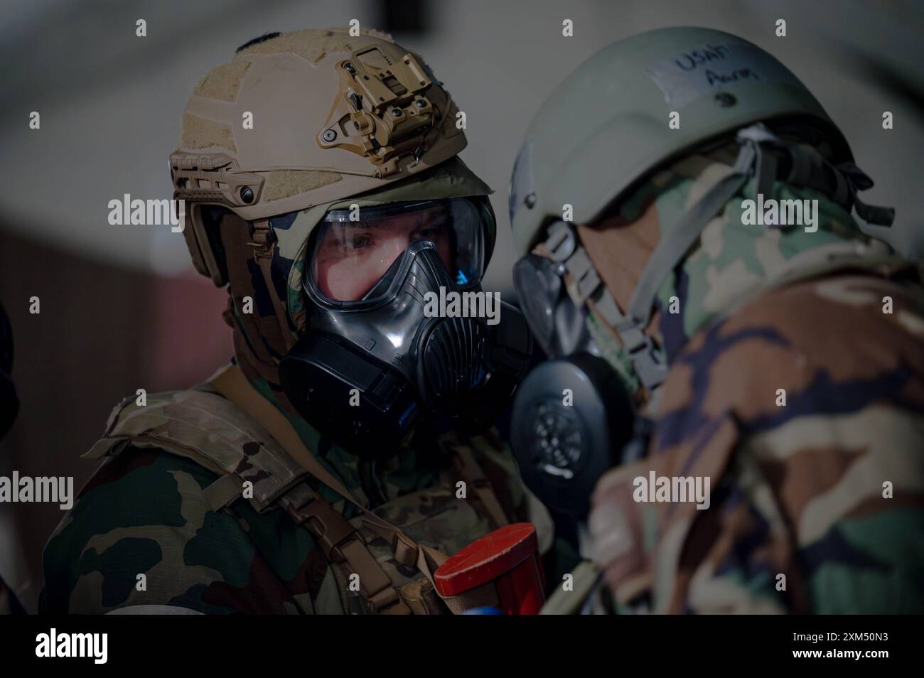 U.S. Airmen with the 628th Civil Engineer Squadron relay chemical ...