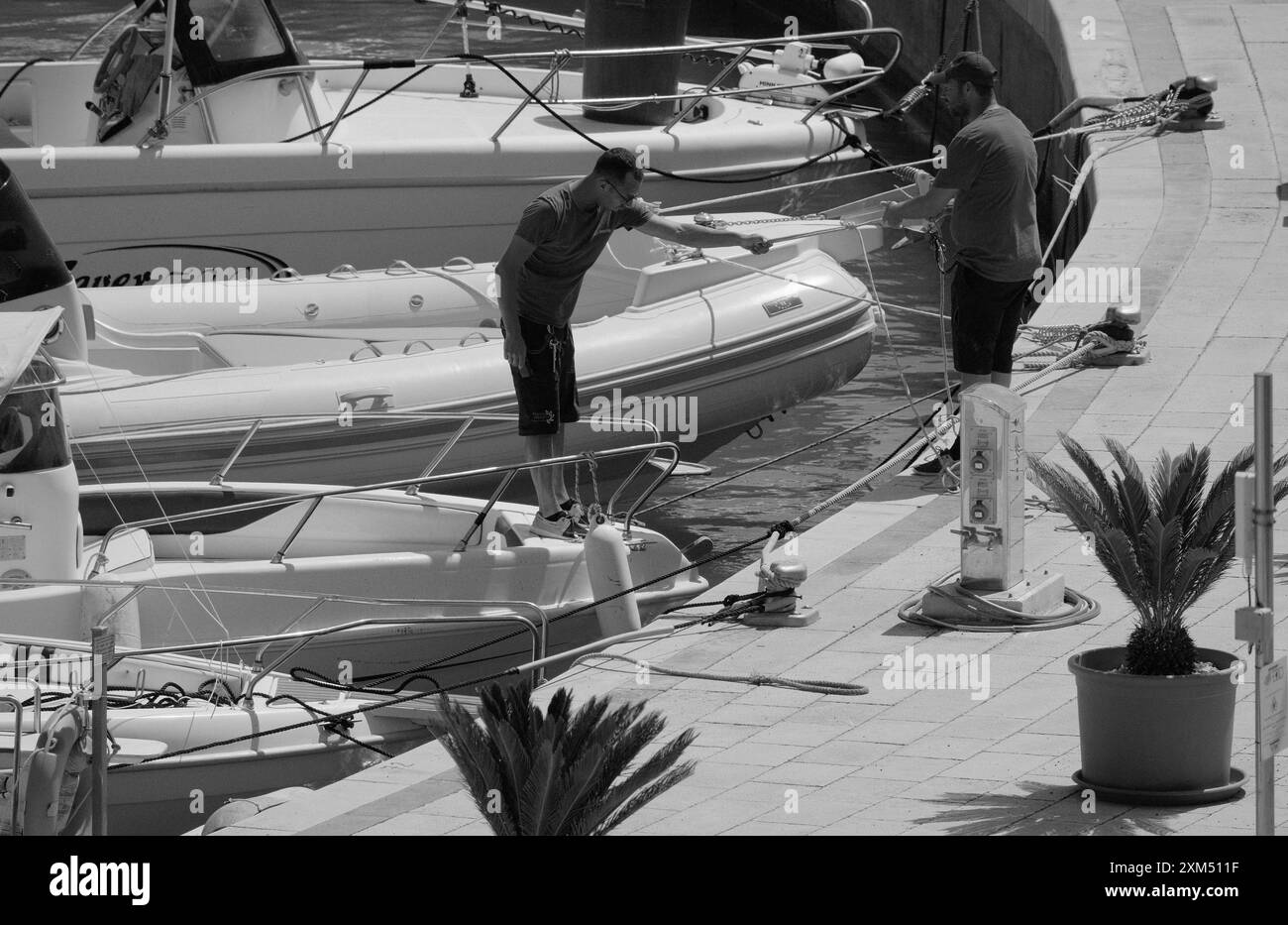 People sail yacht in harbor Black and White Stock Photos & Images - Alamy