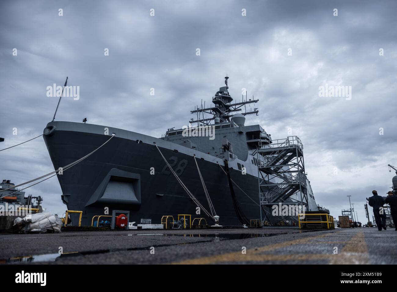 The USS Fort Lauderdale (LPD-28) sits at a port during Defense Support ...