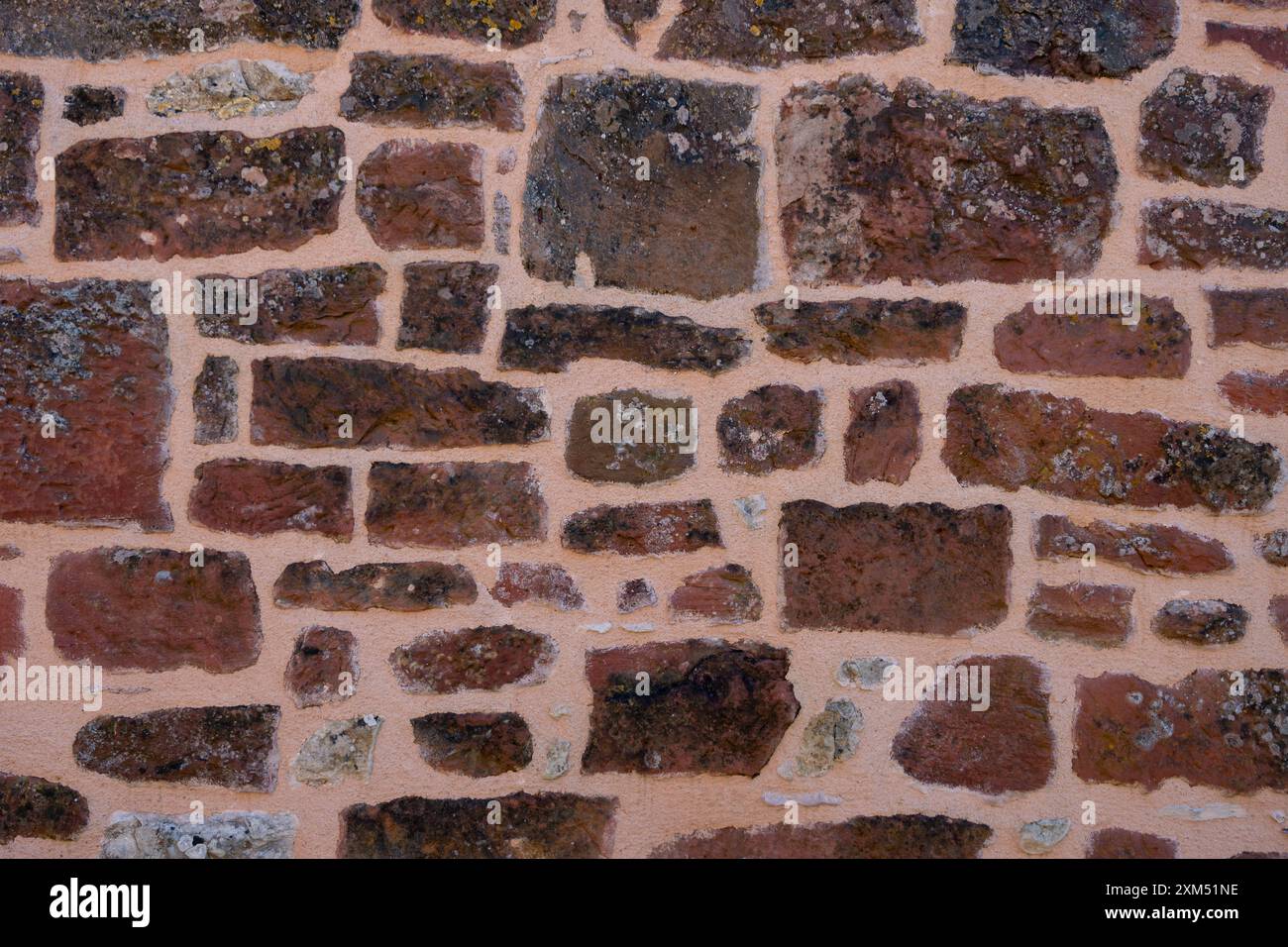 Red brick background in Collonges-la-Rouge village one of the most ...