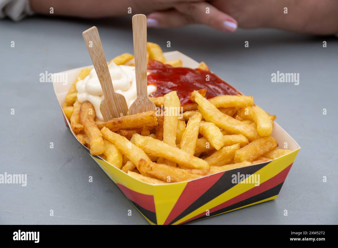 Belgian street and fast food, paper box in colors of Belgian flag with ...