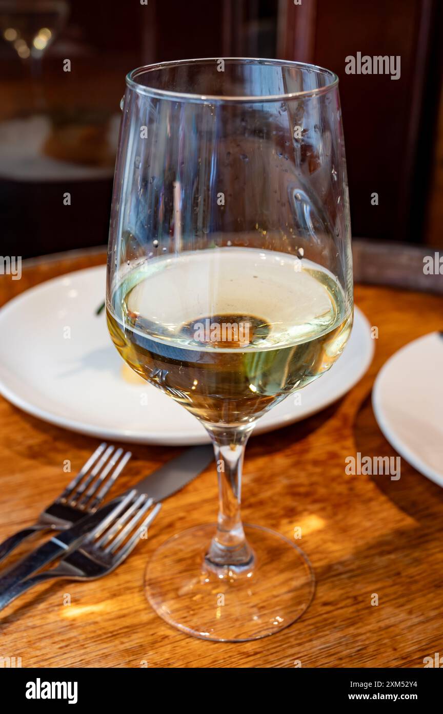 Glasses of txakoli or chacolí slightly sparkling very dry white wine ...