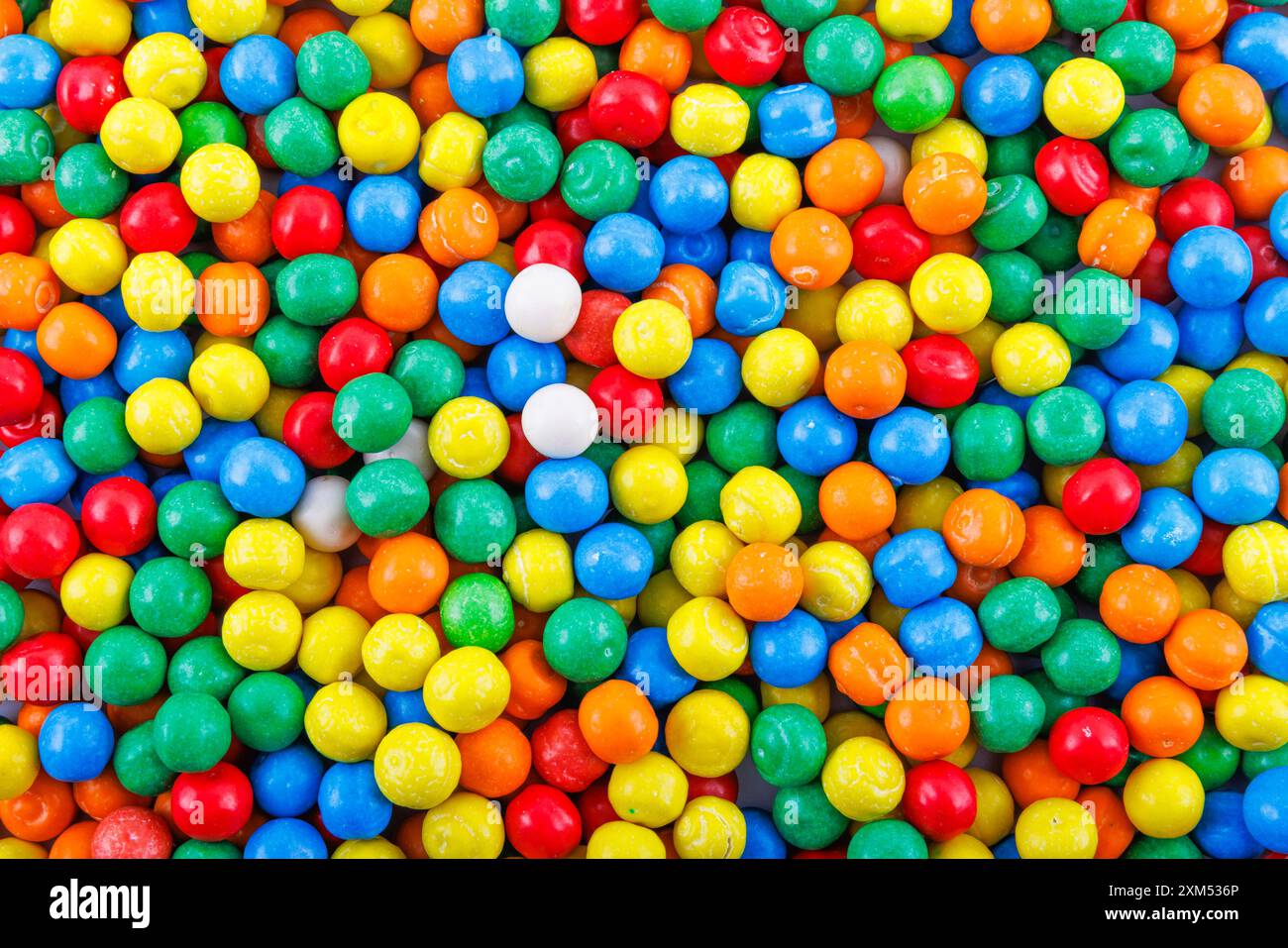 Colorful background of assorted shiny round gumballs. Background photo ...