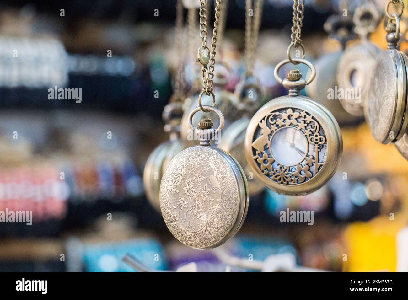 Set of retro styled pocket watches hanging Stock Photo - Alamy