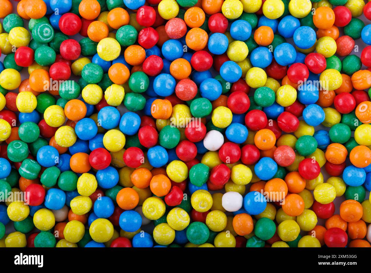 Colorful background of assorted shiny round gumballs. Background photo ...