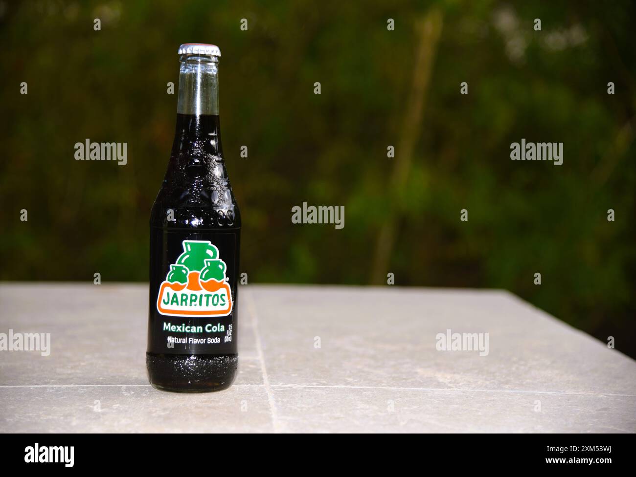 Bottle of Jarritos natural cola soda made in Mexico Stock Photo - Alamy