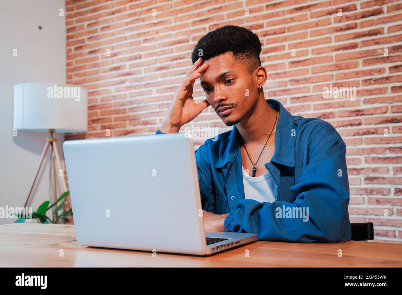 Man looks weary working on hi-res stock photography and images - Alamy