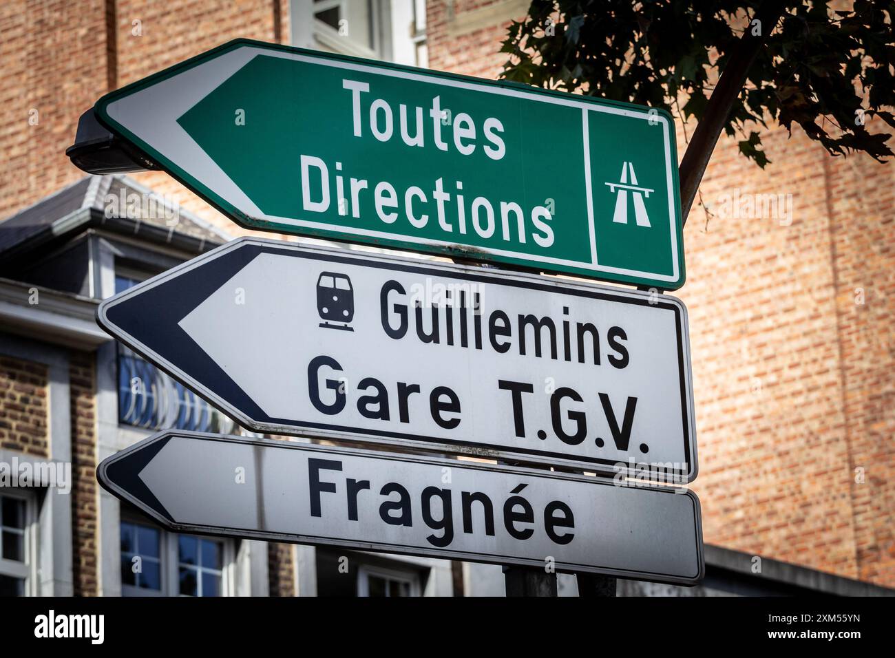 Belgian road signs indicating various directions in Liege, including ...