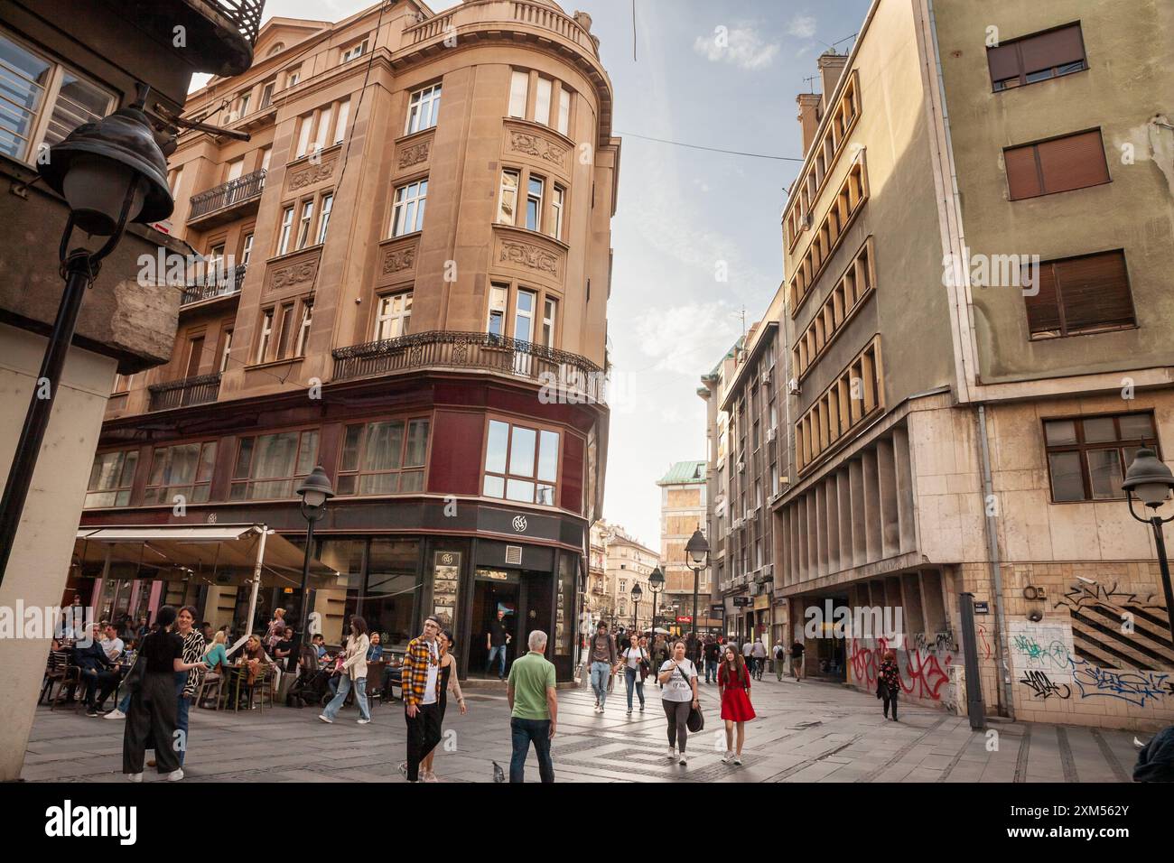 The photograph shows people walking on Čika Ljubina Street in the ...