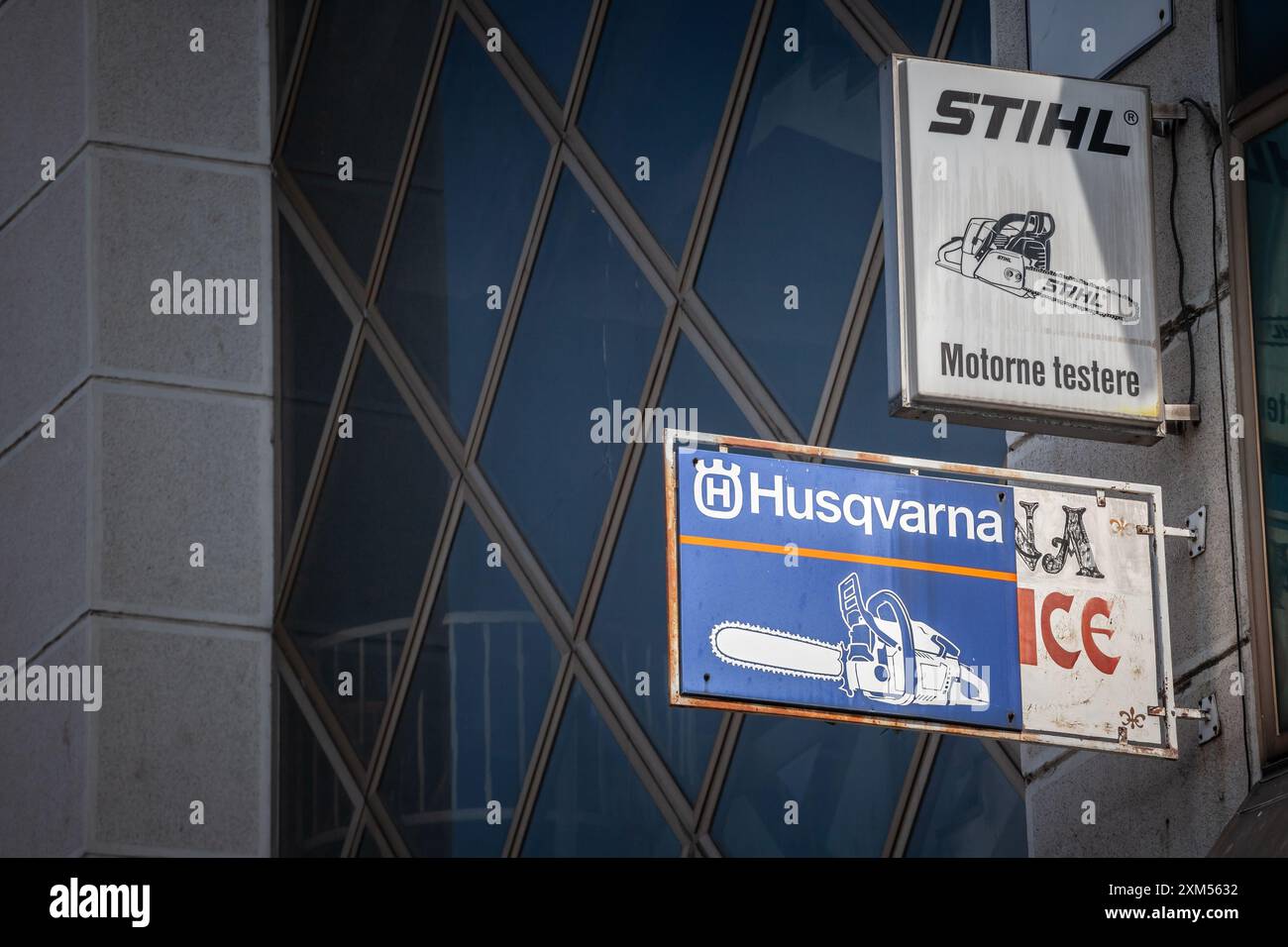 Picture of a sign with the logos of Stihl and husqvarna on their ...