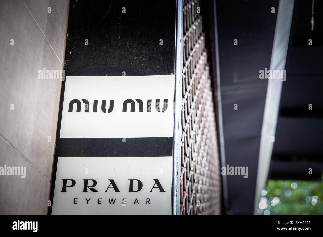 Picture of a sign with the logo of Miu Miu in front of their retailer ...