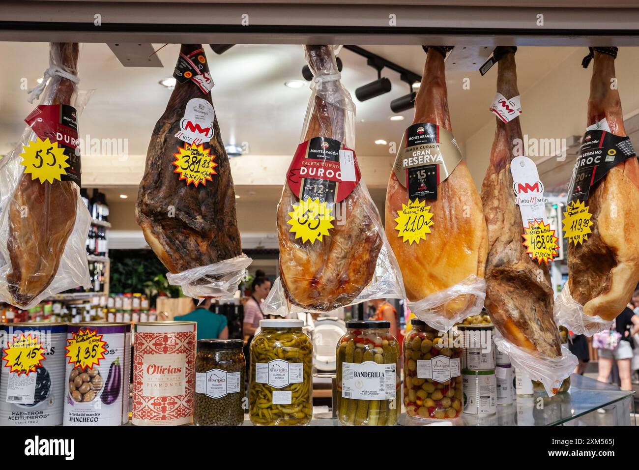 A market scene in Riga, Latvia, featuring Spanish hams for sale. The ...