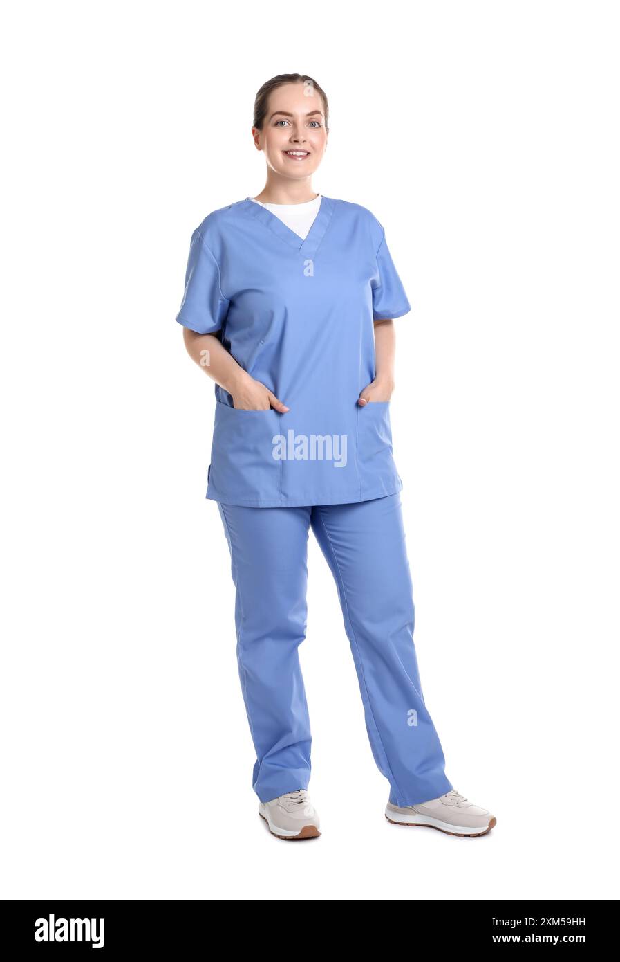 Full length portrait of professional nurse in uniform on white ...