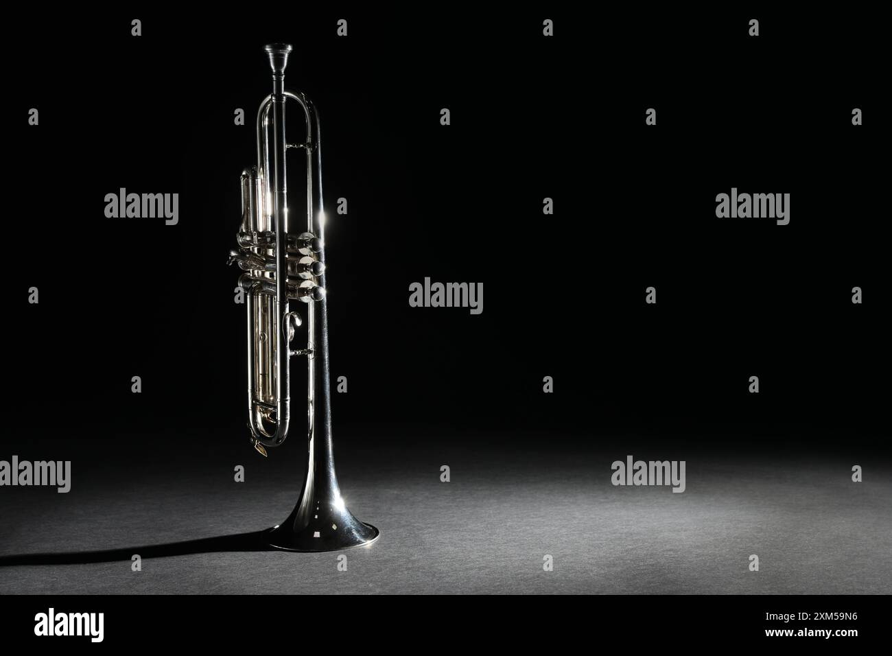 Shiny trumpet on black hi-res stock photography and images - Alamy