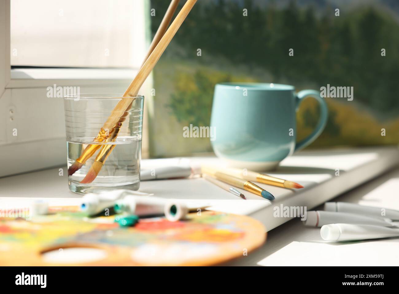Artist's palette, brushes and paints on window sill Stock Photo - Alamy